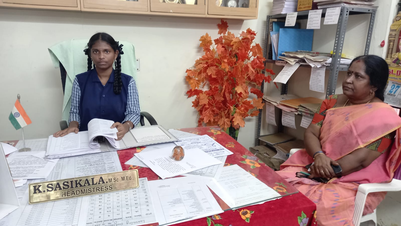 The head teacher seated the class 12 student who won the challenge ...