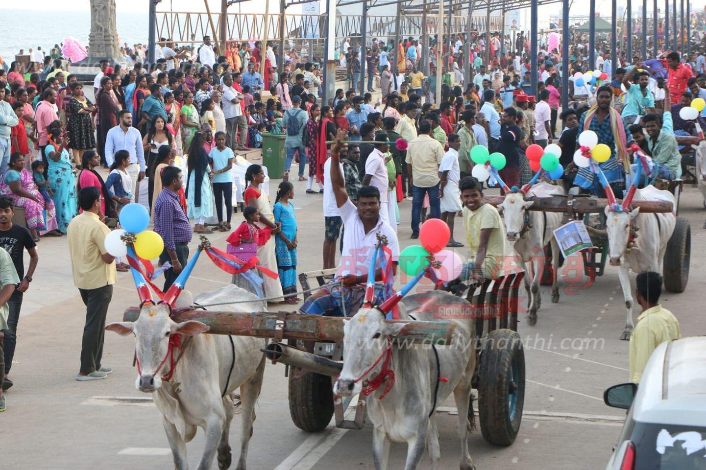 A procession of bullock carts along the beach road | கடற்கரை சாலையில் ...