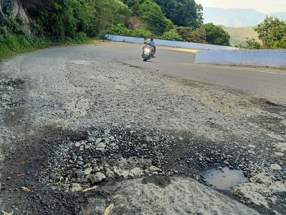 Unmaintained Tamil Nadu-Kerala Link Road: Bumpy and potholed footpath ...
