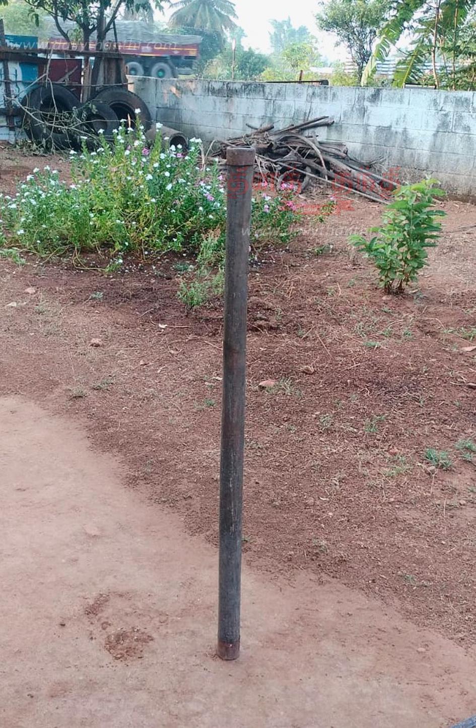 Near Perundurai A plunger standing vertically on the ground during a ...