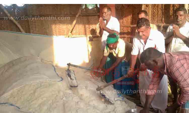 Food is given to the devotees by stirring the rice with a spade ...